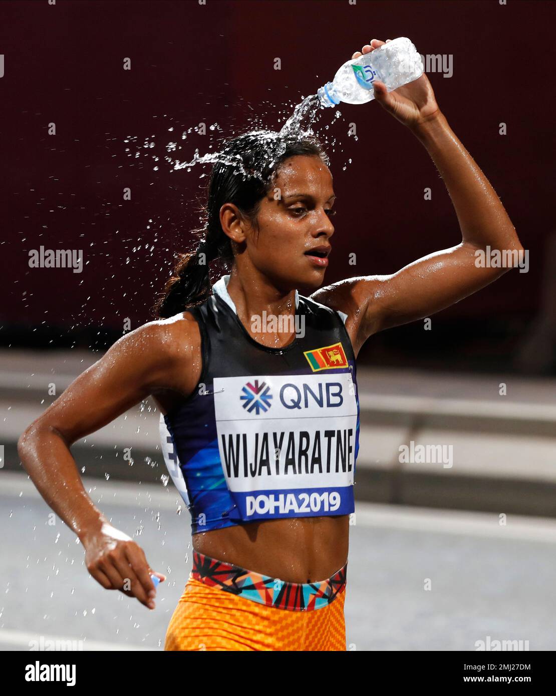 Hiruni Kesara Wijayaratne, of Sri Lanka, races during the women's ...