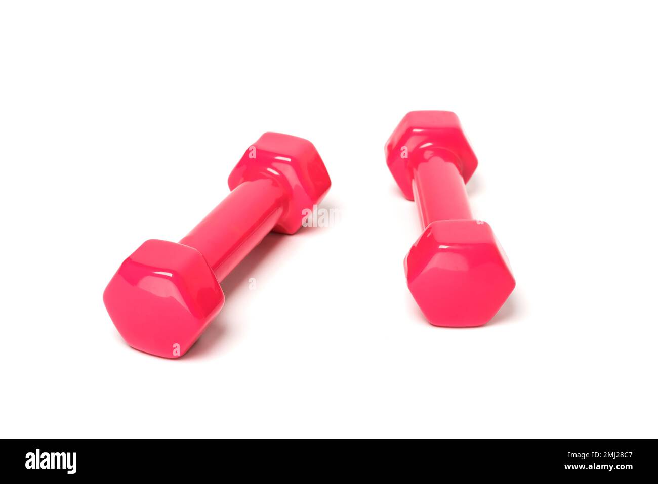 Pink or red dumbbells isolated on white background Stock Photo - Alamy