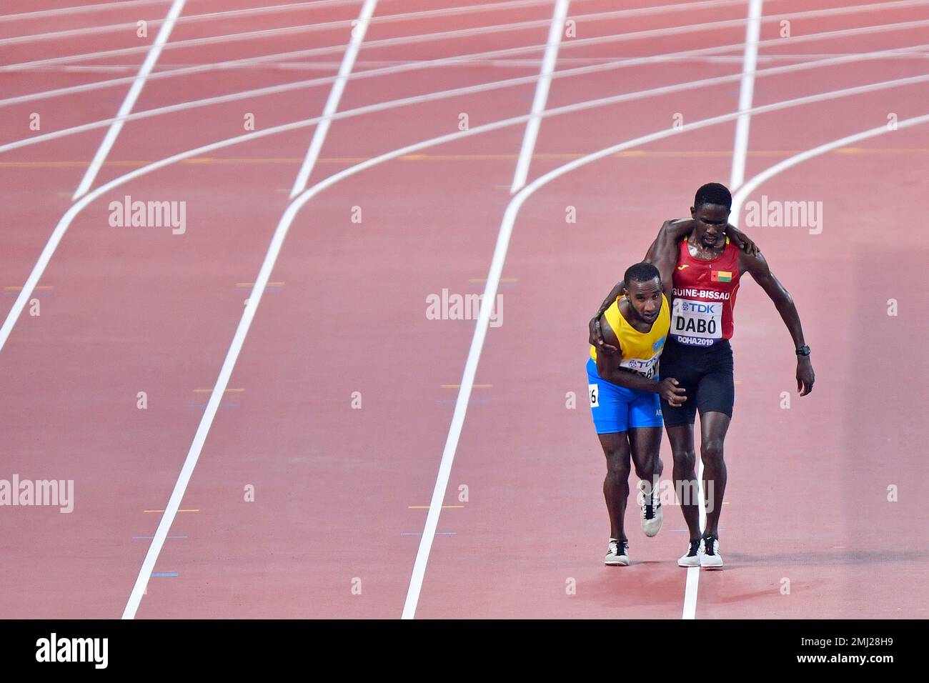 Braima Suncar Dabo of Guinea Bissau carries Jonathan Busby of Aruba to ...