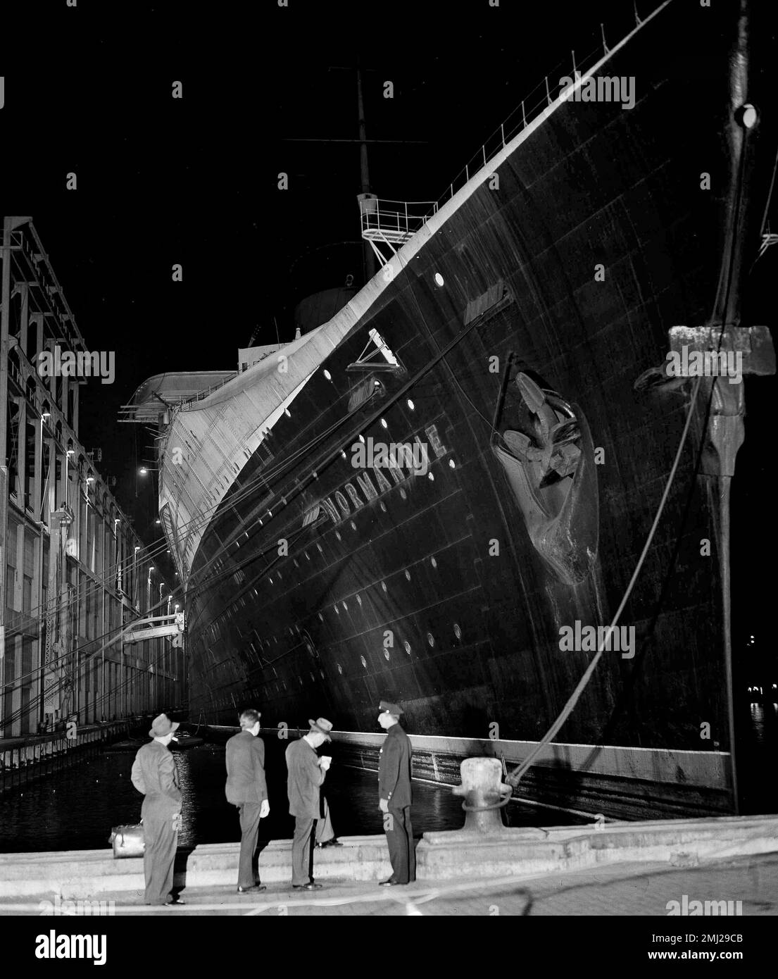 The $60 million French liner "Normandie," tied up at this Hudson River ...