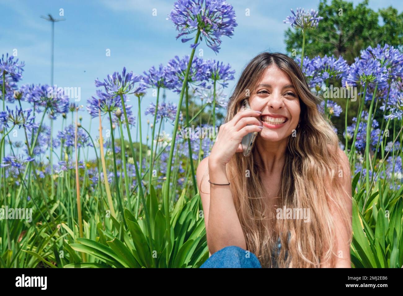 beautiful young long haired latin colombian woman, wearing blue clothes ...
