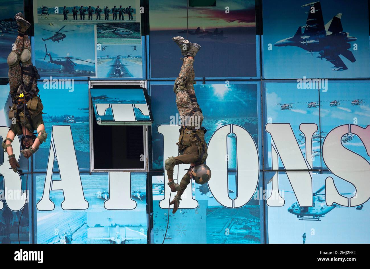 Indian Air Force's Garud commandos display their skills during an air show ahead of the ...