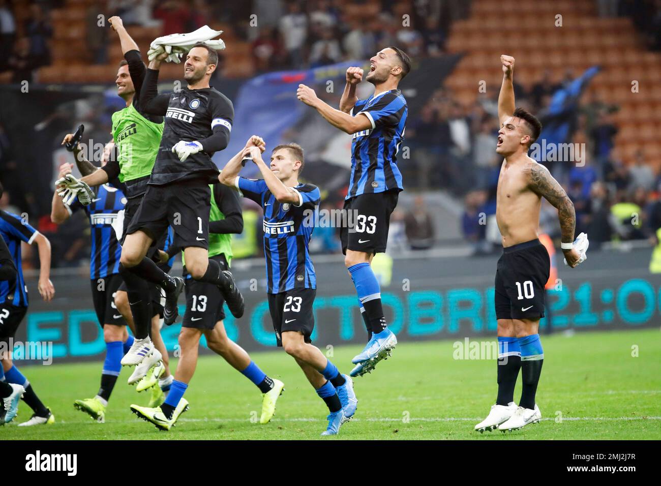 In her Milan players celebrate their 1-0 victory at the end of a Serie ...