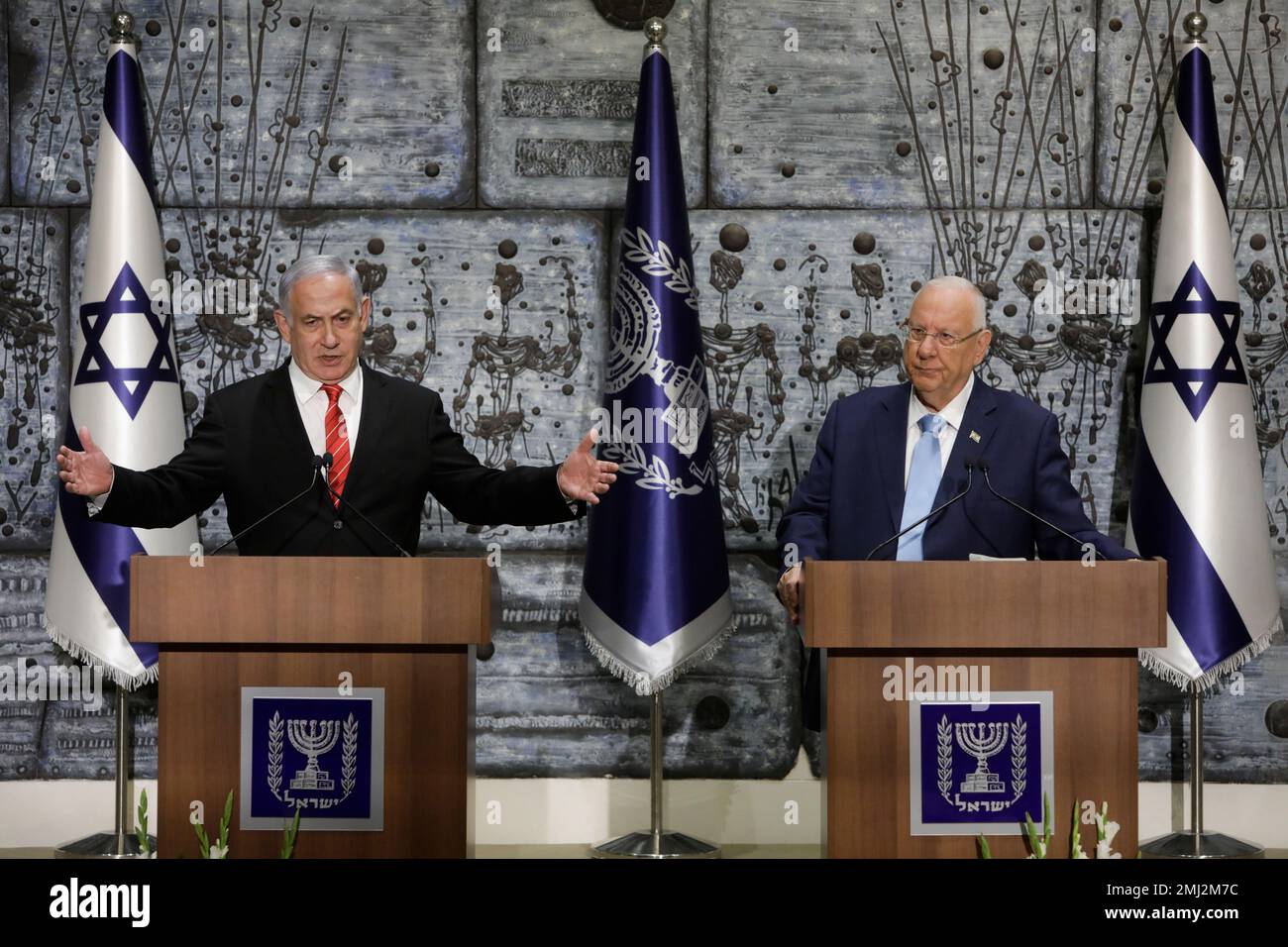 Israeli President Reuven Rivlin, right, and Israeli Prime Minister Benjamin Netanyahu give a ...