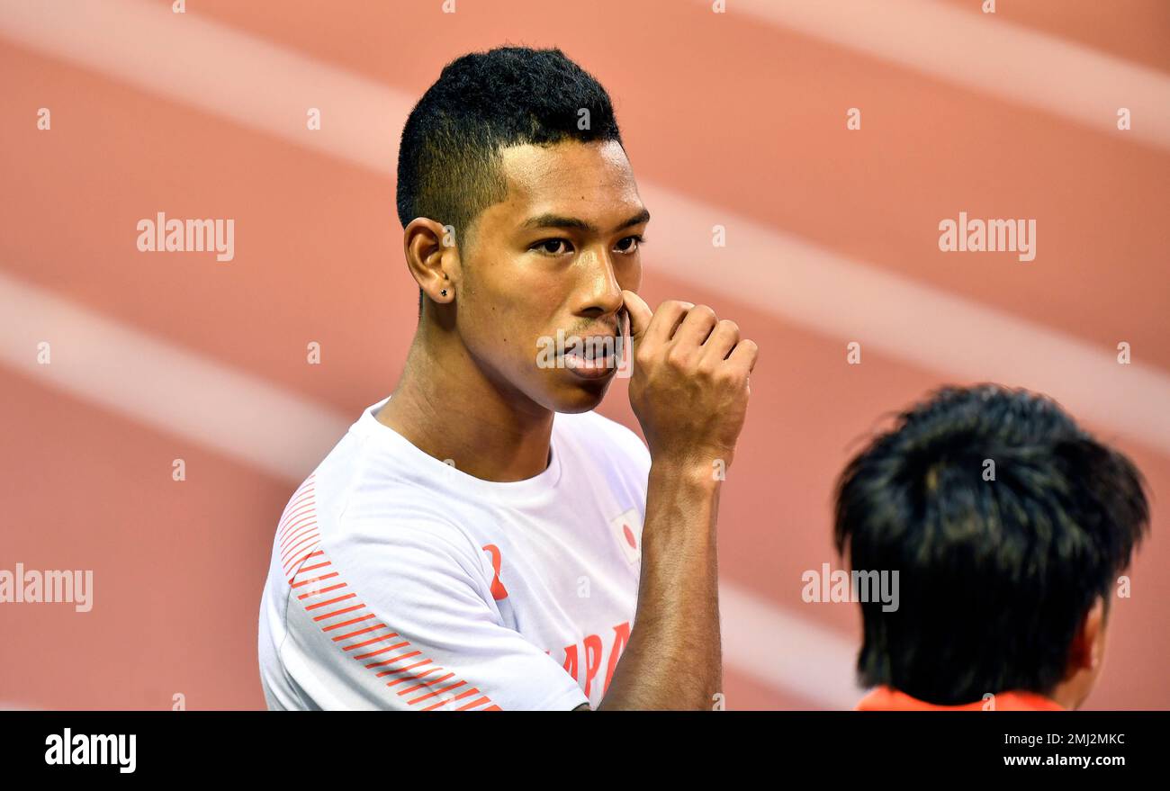 Japan's Abdul Hakim Sani Brown exercises during an evening training ...