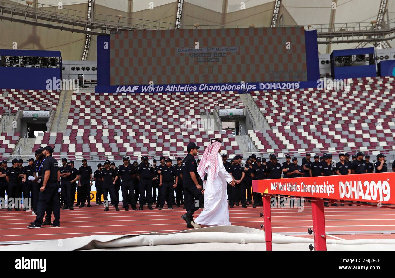 Security guards wait inside the Khalifa International Stadium prior the ...