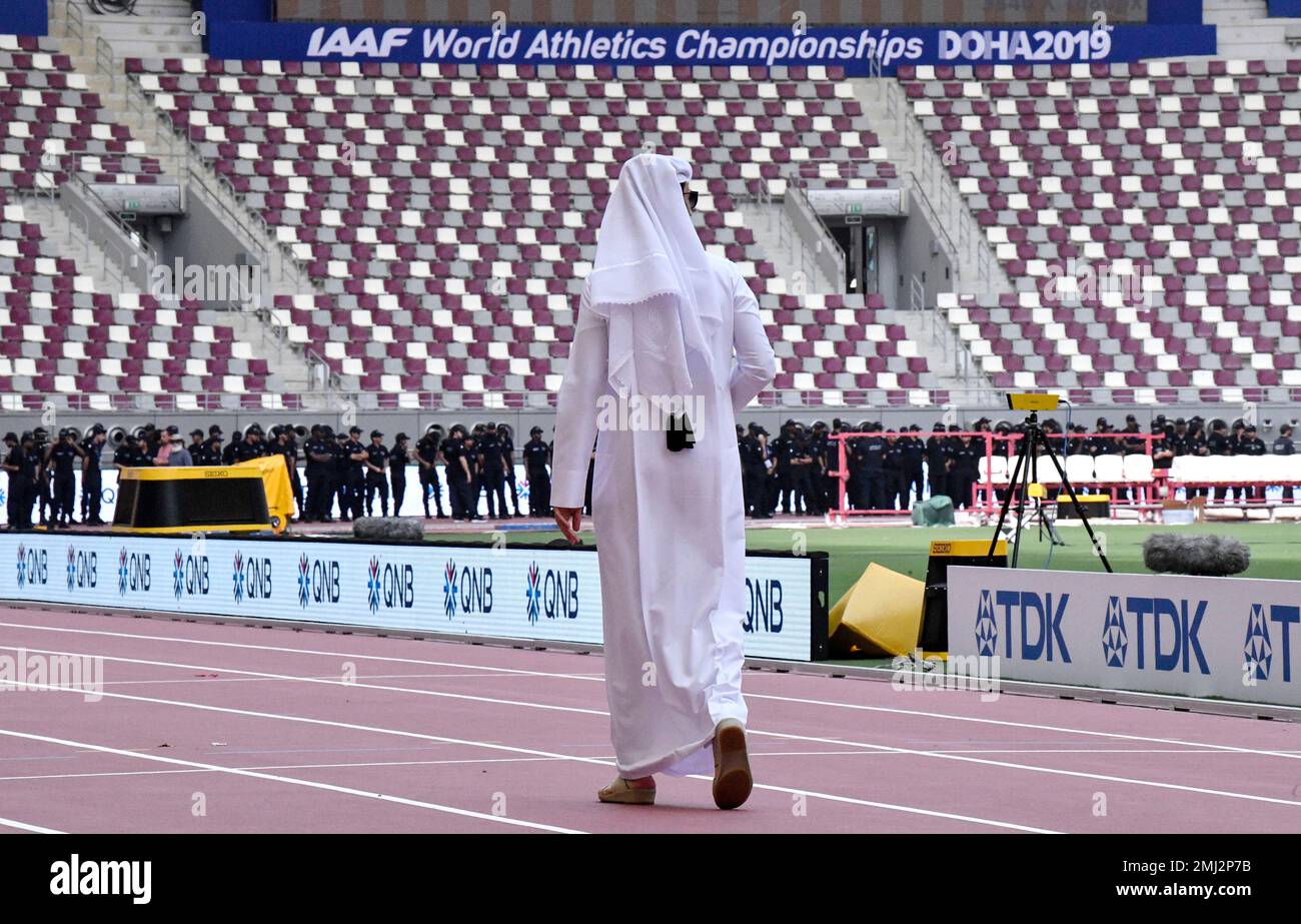 A man in traditional Arabic clothes walks on the track at the Khalifa ...