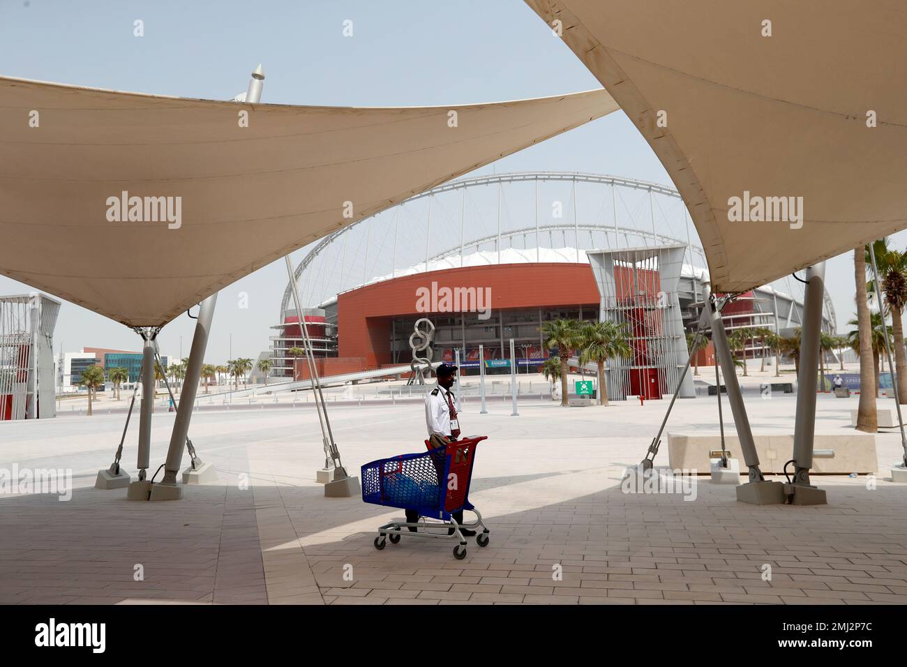 Security guard pushes a trolley outside the Khalifa International ...