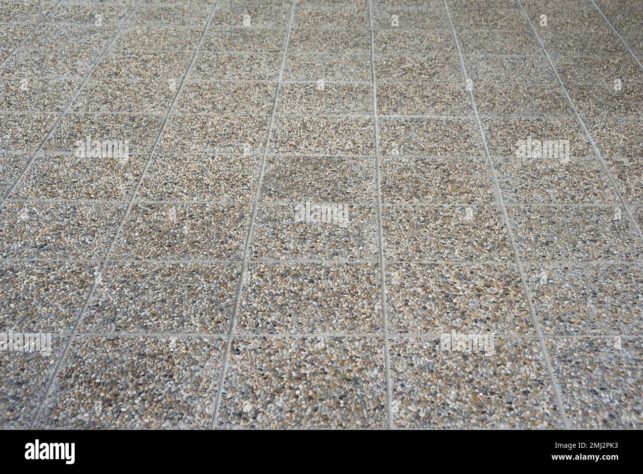 Pebble stones tiles on a outside terrace Stock Photo - Alamy