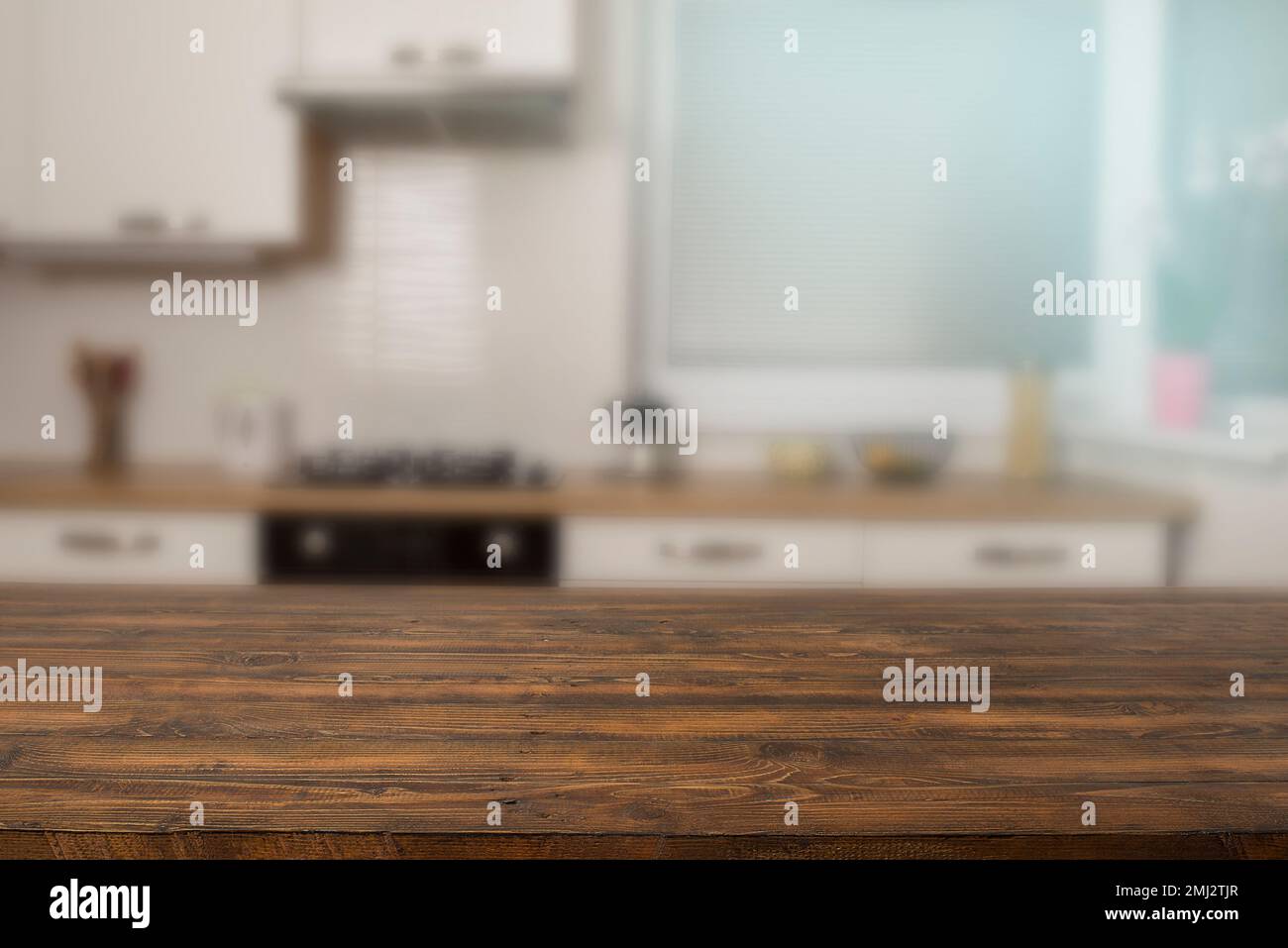 Wooden counter top on kitchen blur background Stock Photo - Alamy
