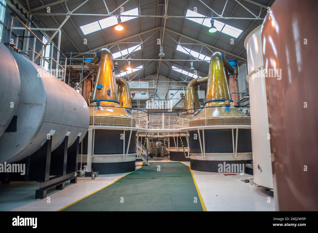 A view of the distillation process with pot stills made of copper for ...