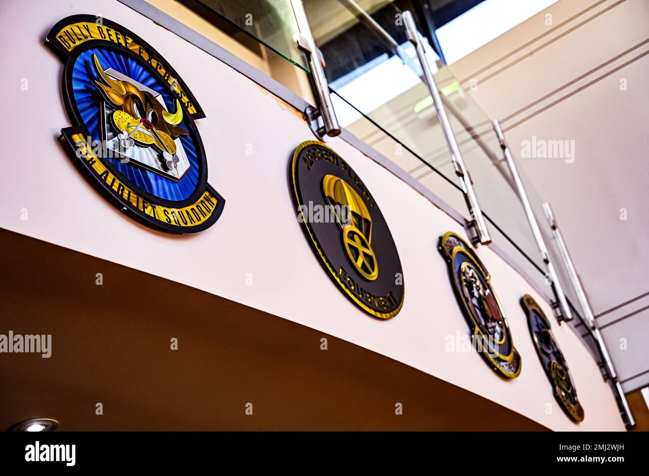 305th Air Mobility Wing Squadron emblems are displayed at the ...