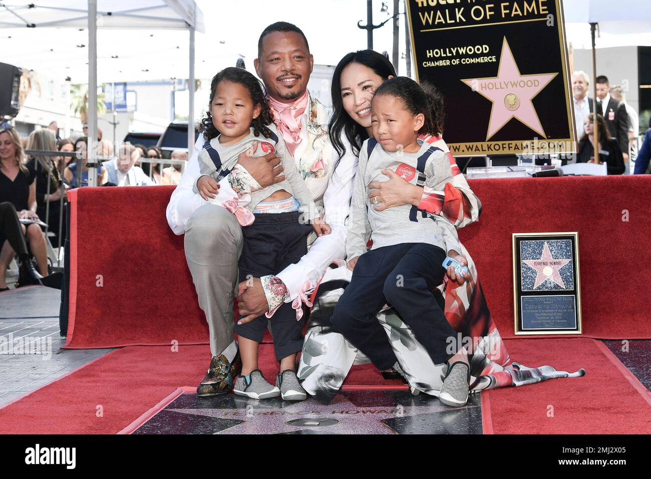 Terrence Howard, left, Miranda Pak and their children attend a ceremony ...
