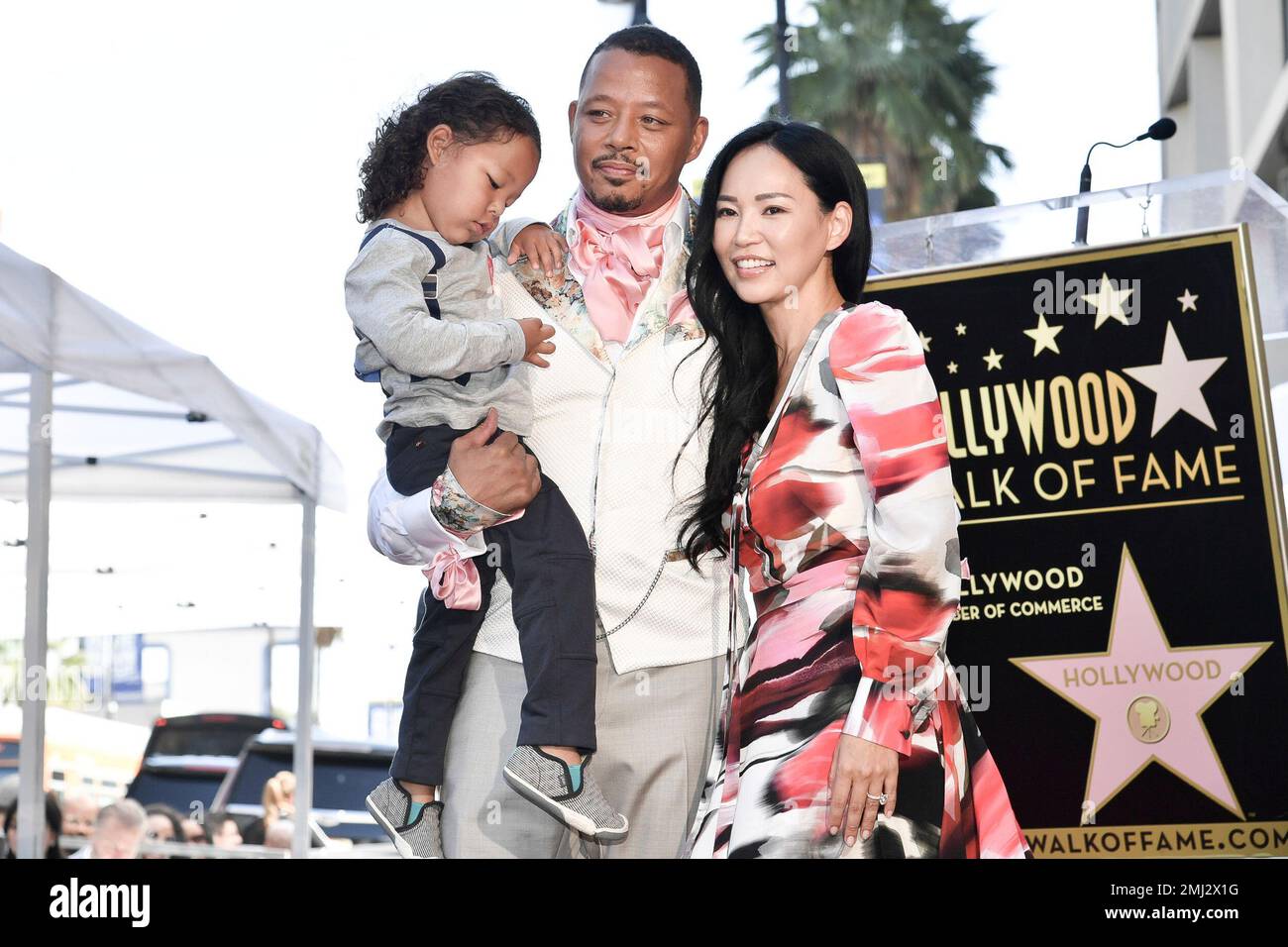 Terrence Howard, left, Miranda Pak and their child attend a ceremony ...