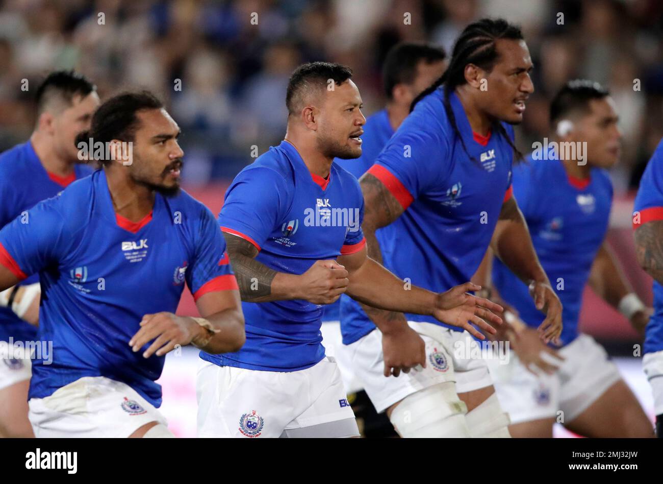 Samoan players perform their pre-game challenge, the Siva Tau, ahead of ...