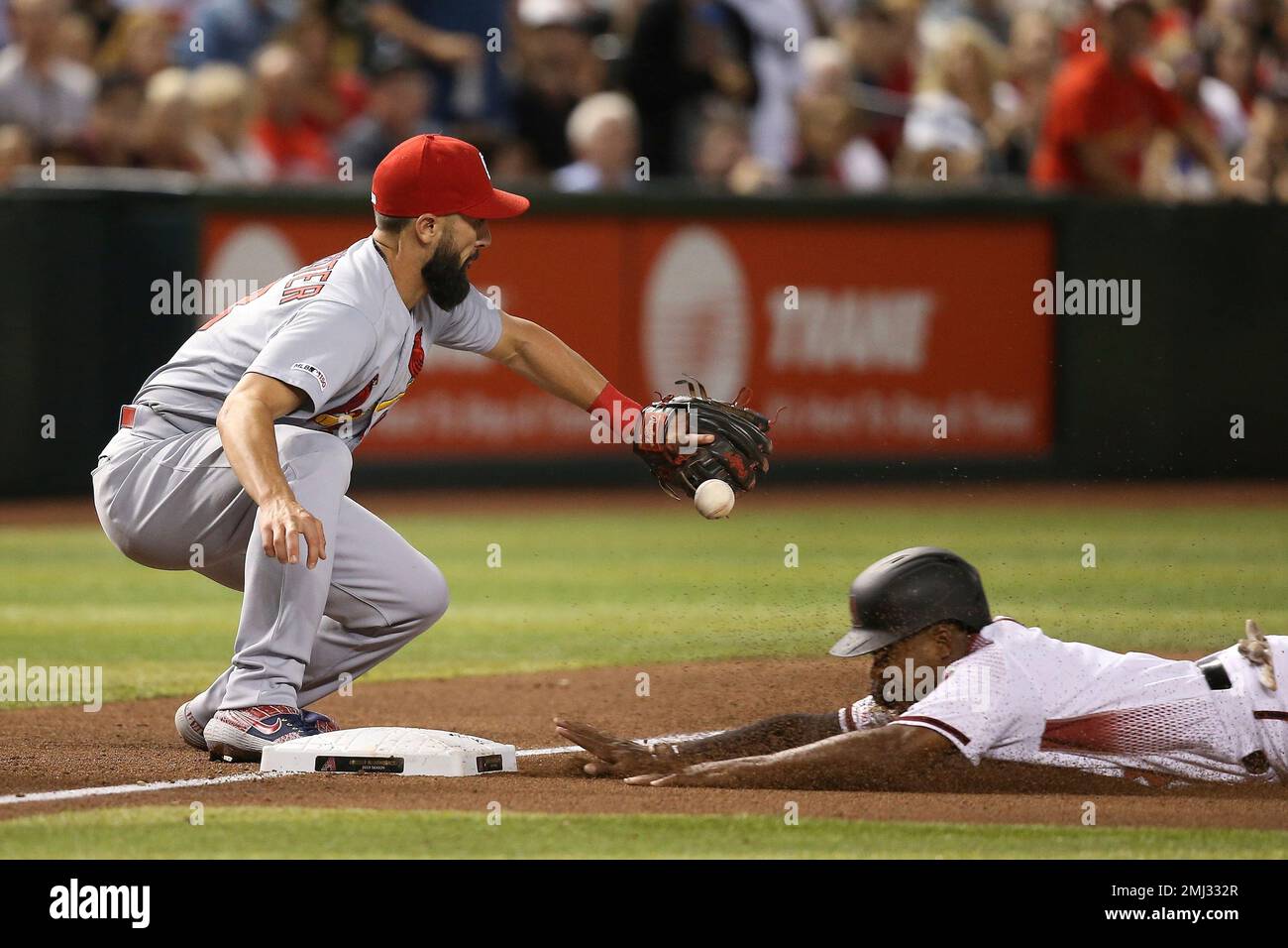 Arizona Diamondbacks' Domingo Leyba, right, slides safely into third ...