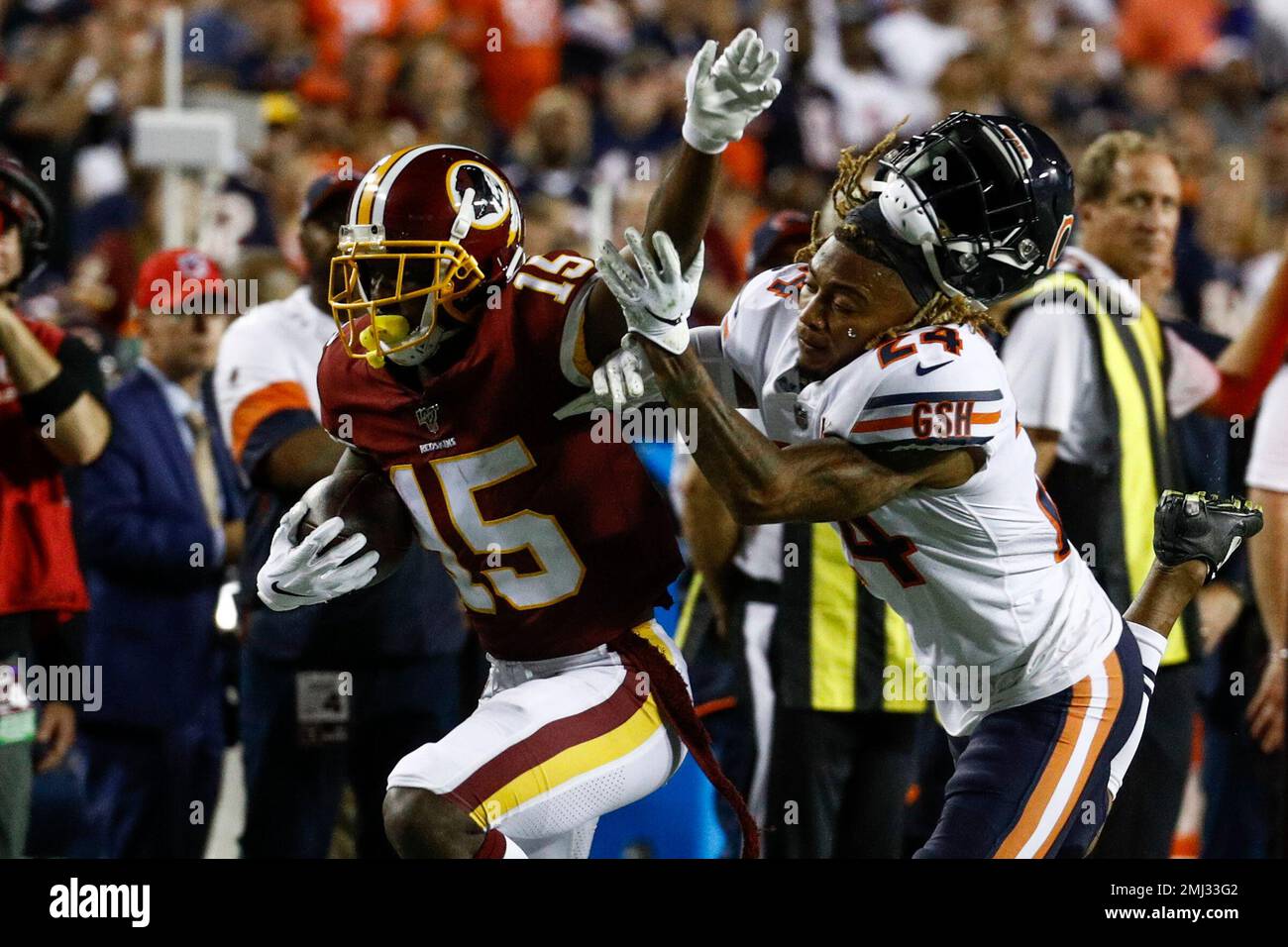 Washington Redskins wide receiver Steven Sims (15) stiff arm's the ...