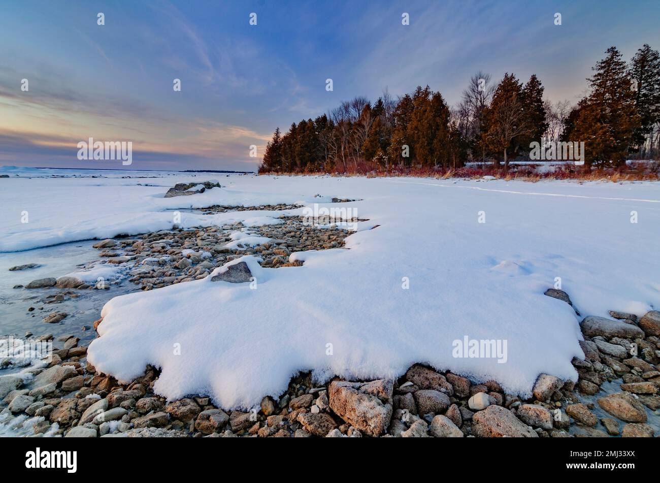 Snow spread on the Green Bay, Lake Michigan shore takes the shape of a ...