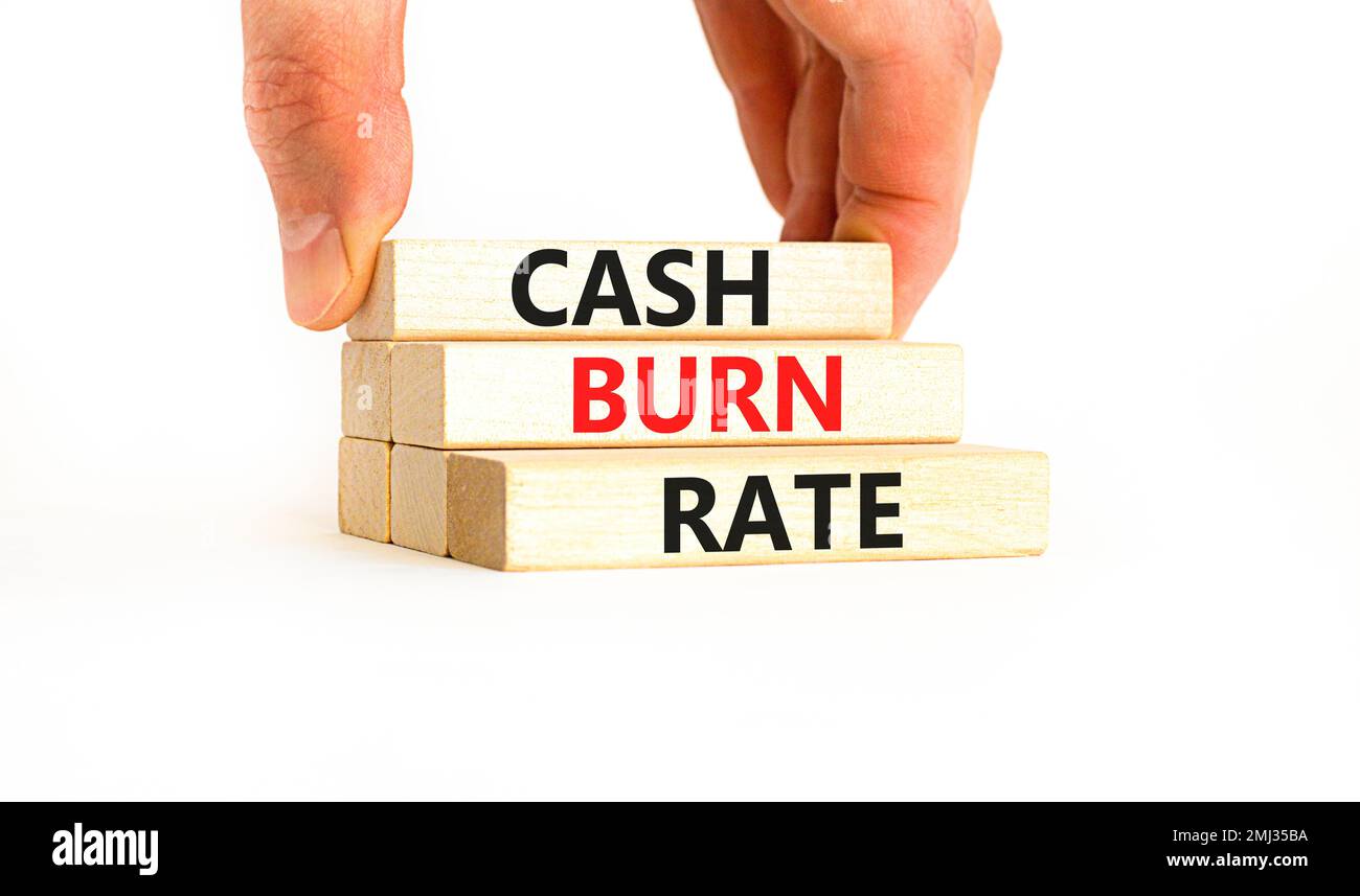 Cash burn rate symbol. Concept words Cash burn rate on wooden blocks on ...