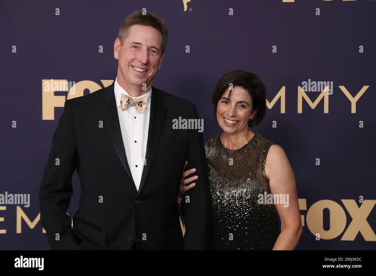 Mark Cendrowski, left, arrives at the 71st Primetime Emmy Awards on ...