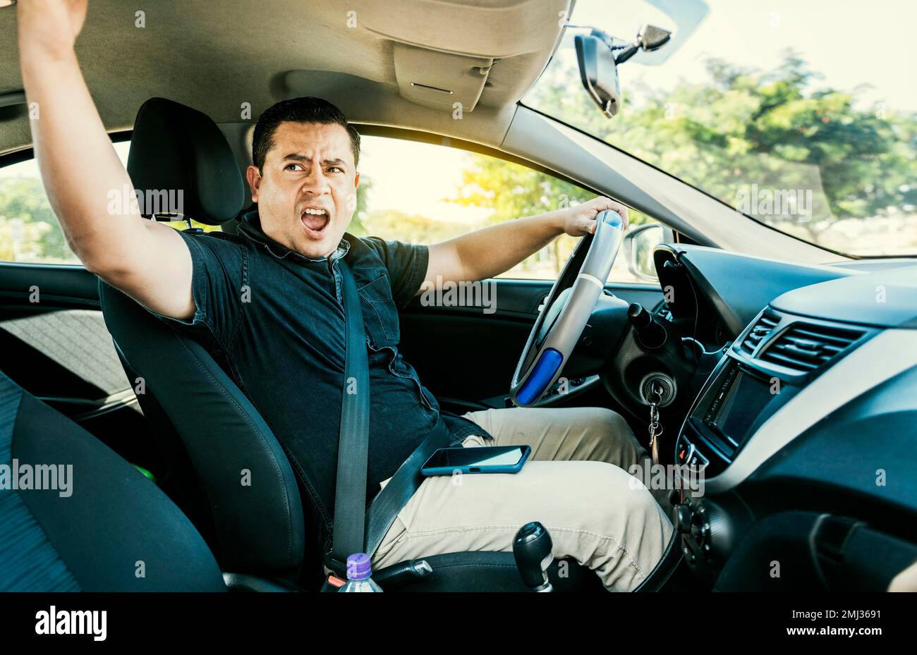 Impatient driver yelling. Angry driver yelling in his car, stressed ...