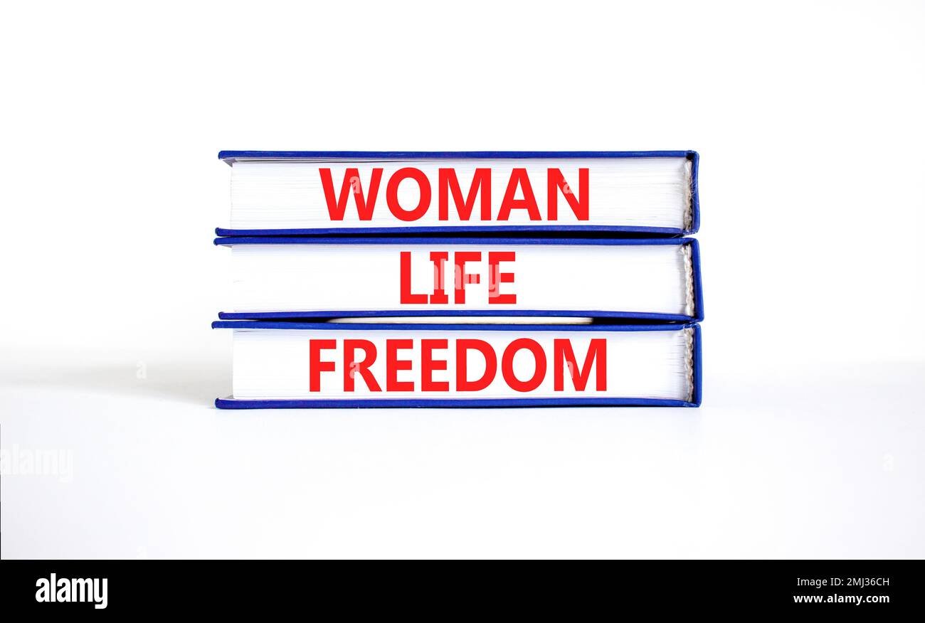 Woman life freedom symbol. Concept words Woman Life Freedom on books on ...