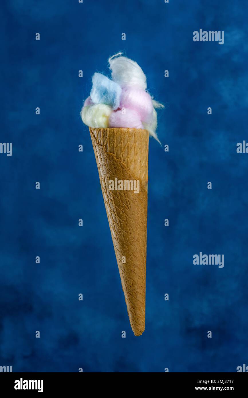 Colored cotton balls in various containers on a blue background Stock ...