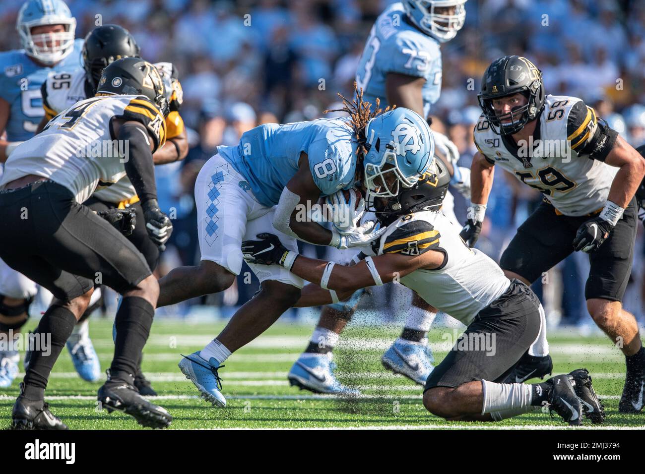 North Carolina's Michael Carter (8) carries the ball as Appalcahian ...