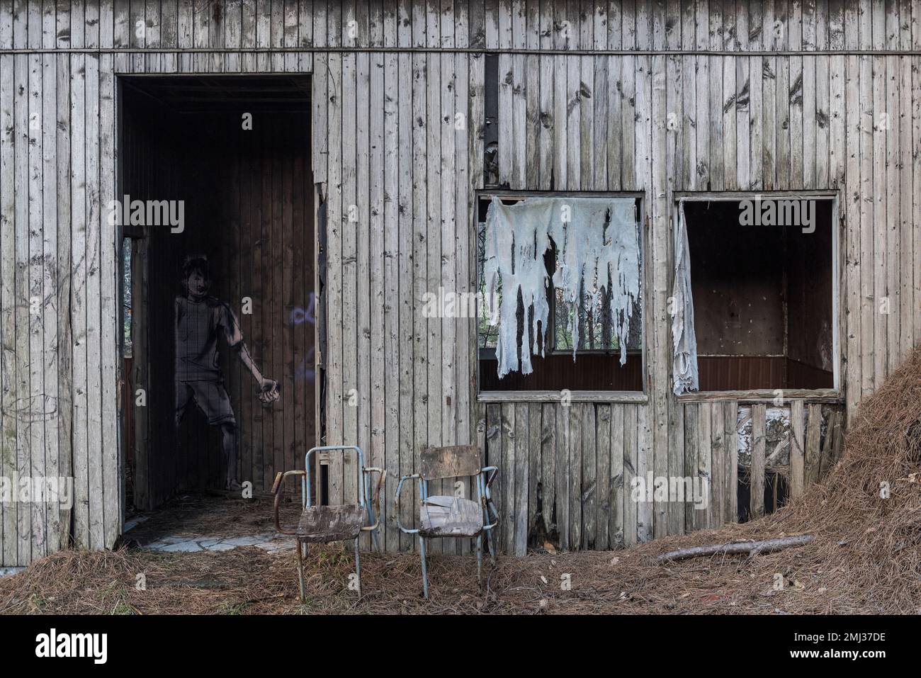 An empty and derelict hut in an old abandoned ski resort in the woods ...