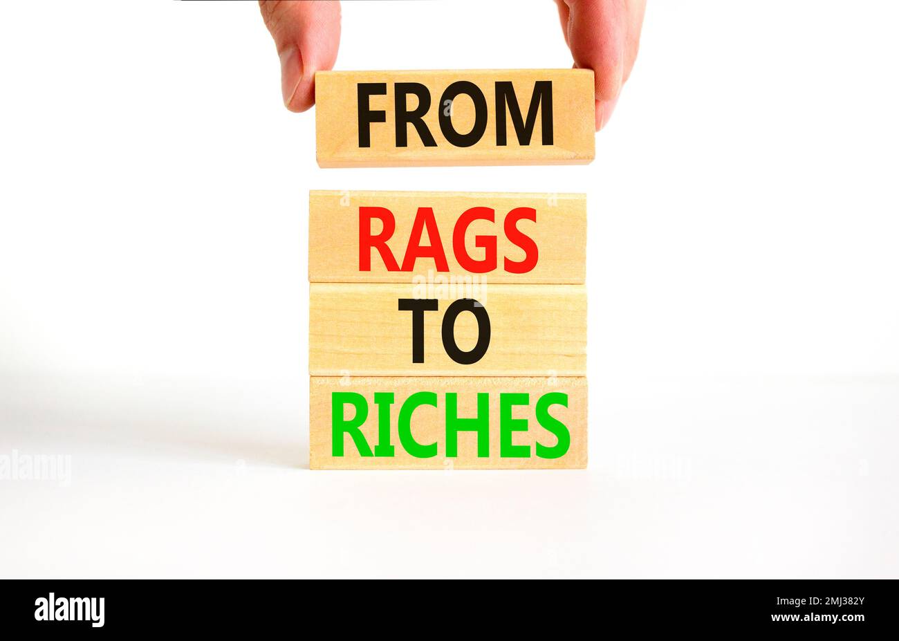 Rags or riches symbol. Concept words From rags to riches on wooden ...