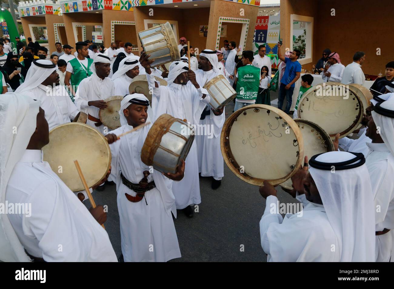 Saudi dancers perform a traditional dance during celebrations marking ...