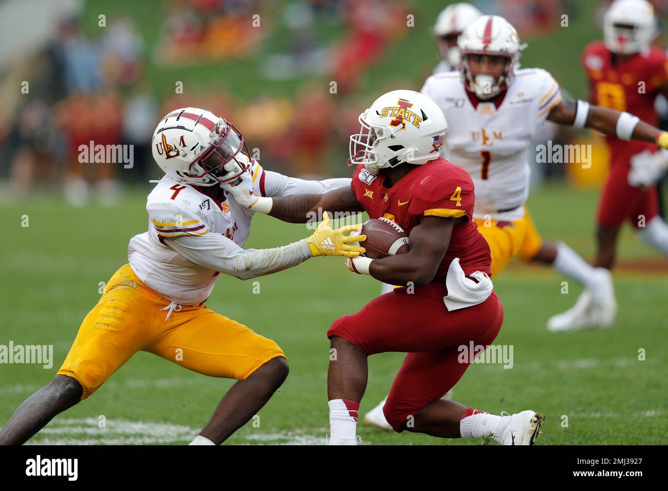 Iowa State running back Johnnie Lang, right, fends off Louisiana-Monroe ...