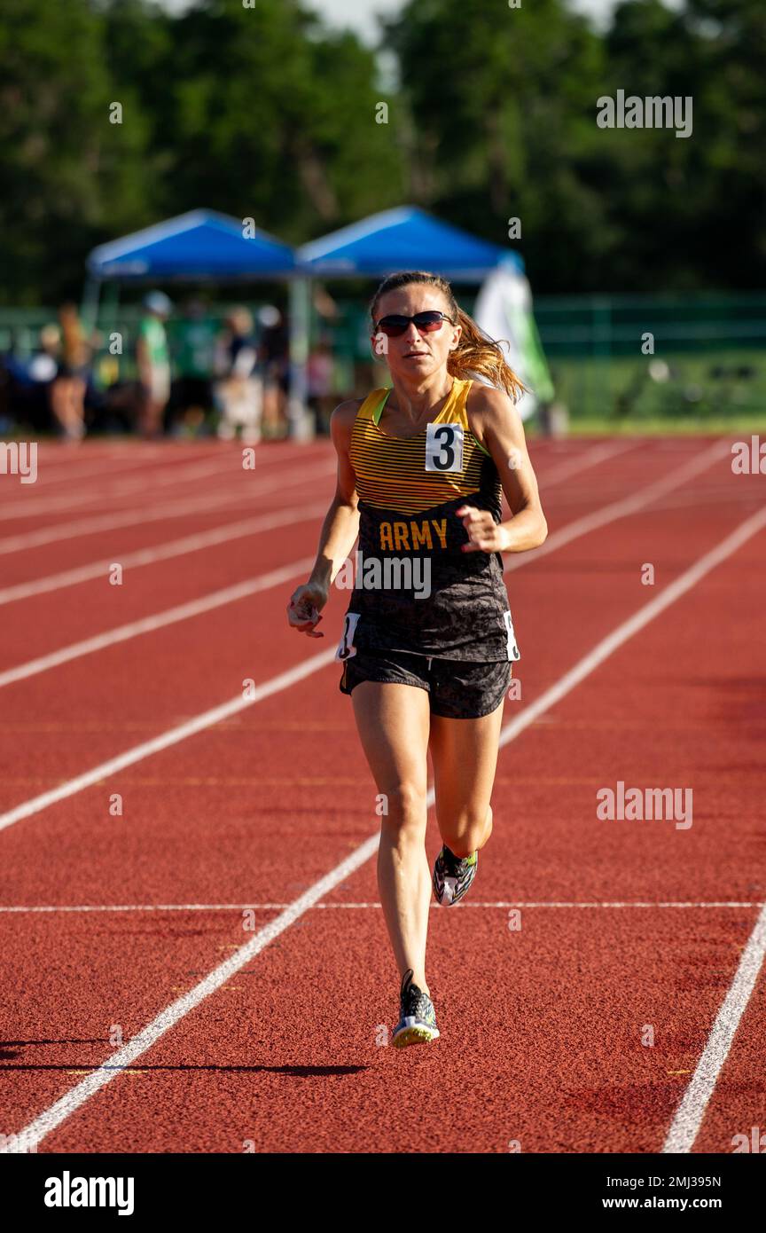 Retired U.S. Army Staff Sgt. Megan Voigt runs toward the finish line while competing in a track ...