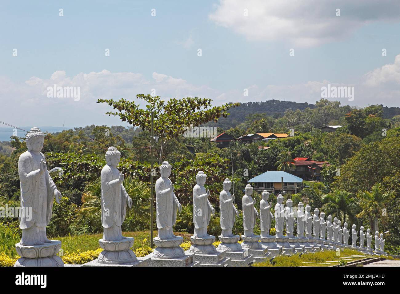 Buddha statues line the path to Puu Sih Syh Temple, Sandakan, Sabah ...