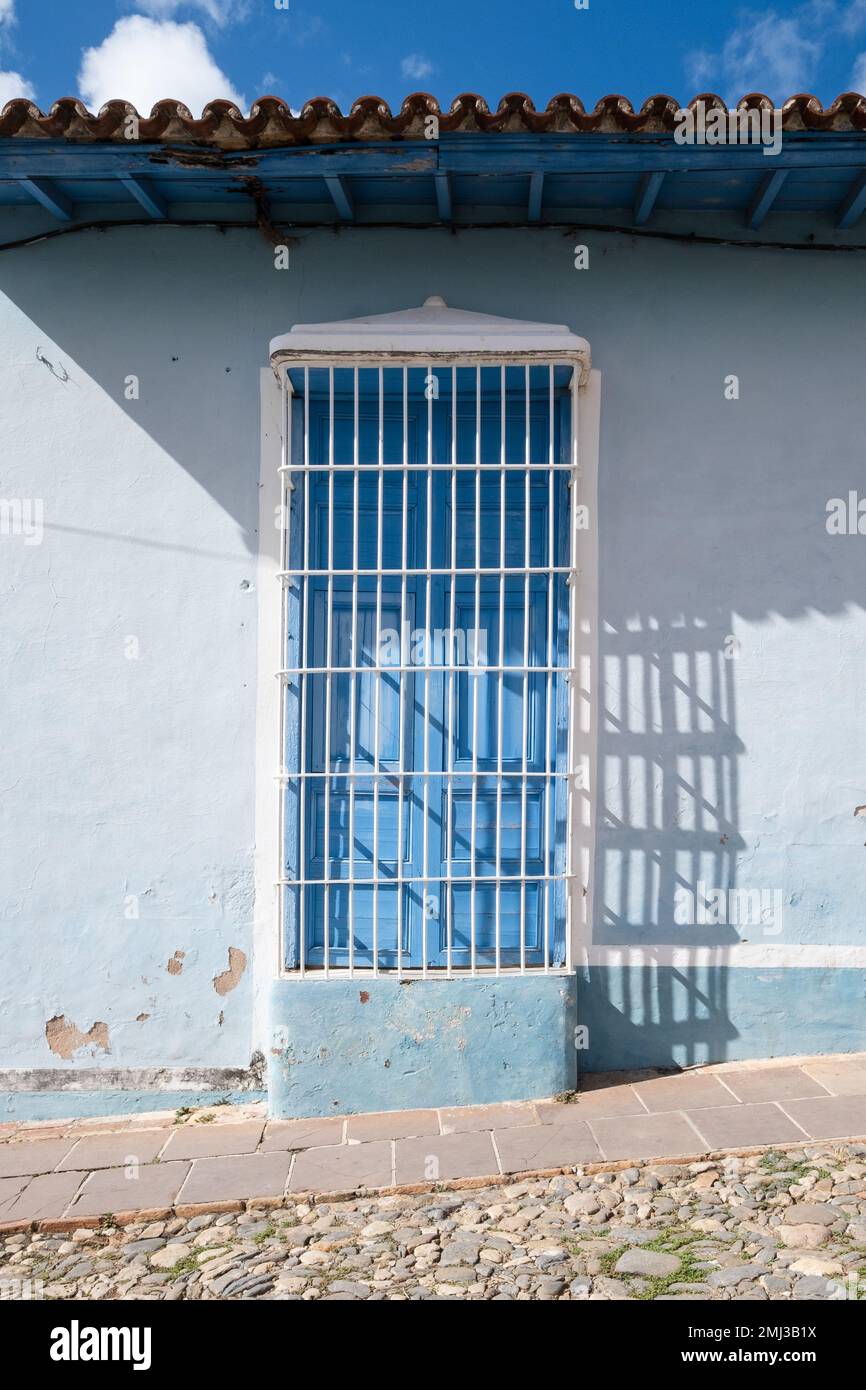 Shuttered window with ornate woode window bars in Trinidad, Cuba Stock ...