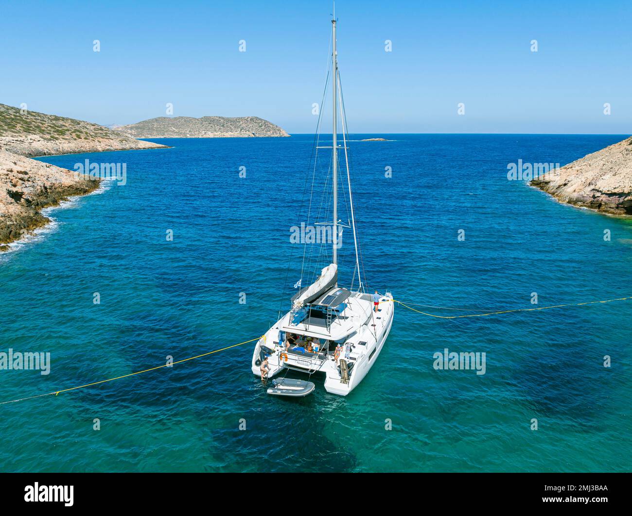 Sailing catamaran with shore lines, Greek island, South Aegean, Greece ...