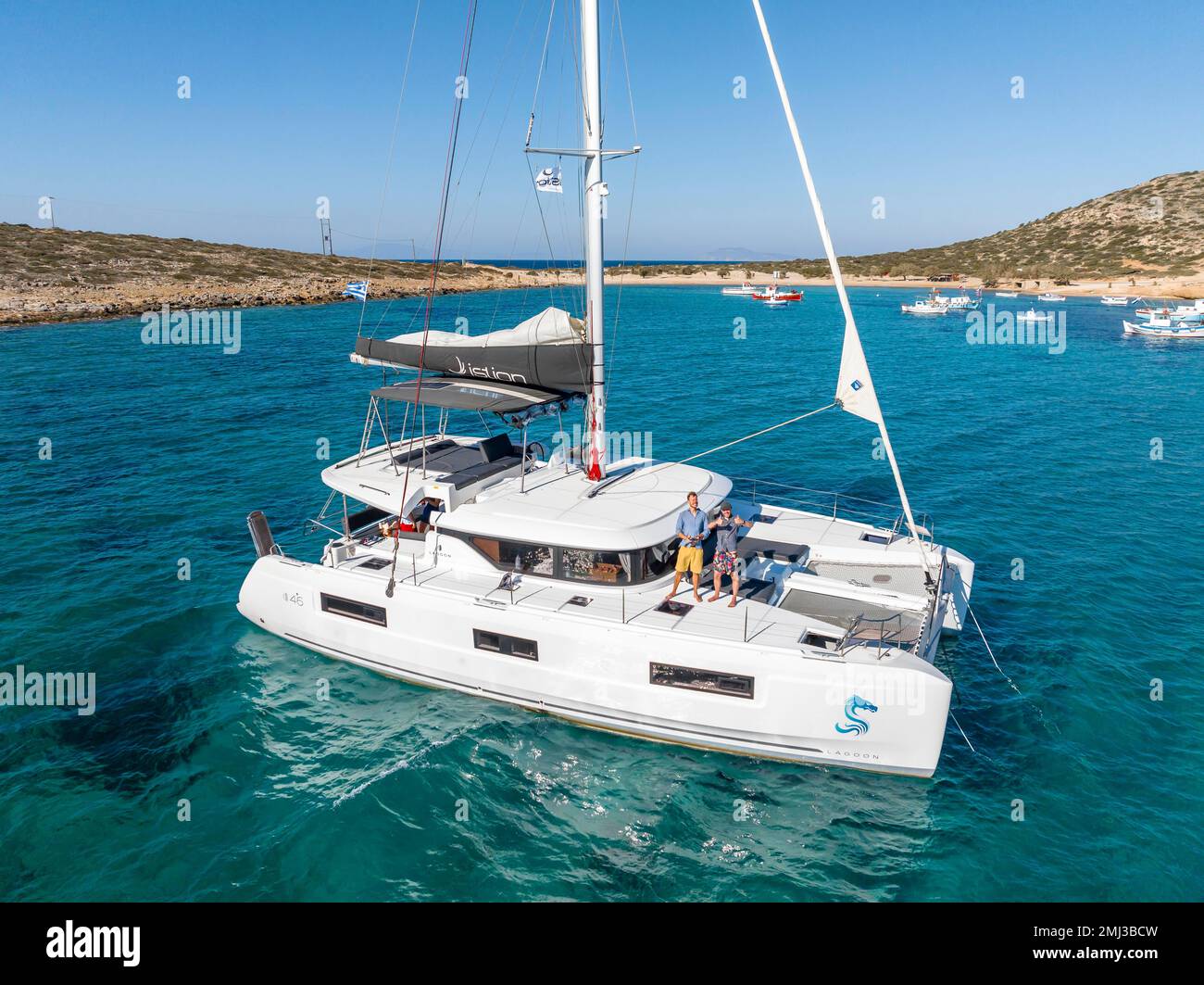 Sailing catamaran in a bay, Cyclades Island, Aegean Sea, Greece Stock ...