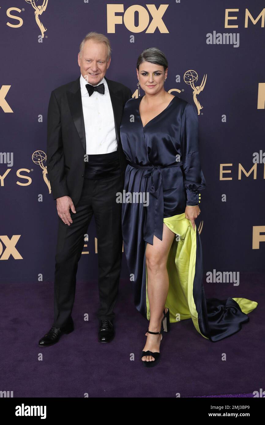 Stellan Skarsgard, left, and Megan Everett arrive at the 71st Primetime ...