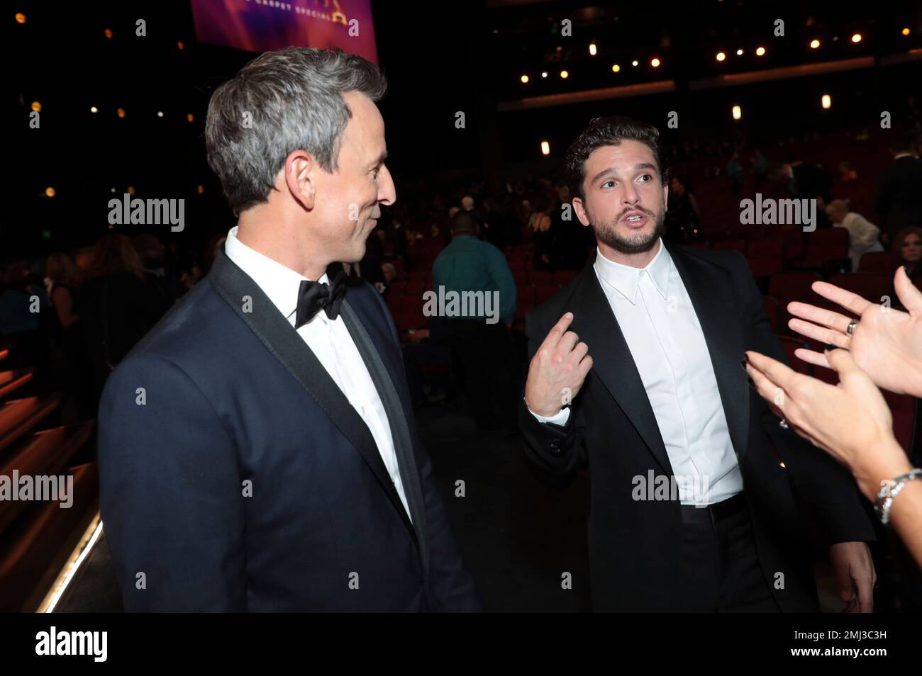 EXCLUSIVE - Seth Meyers, left, and Kit Harington speak in the audience ...