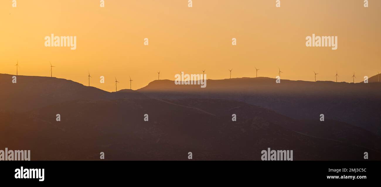Wind turbines on the horizon, sunset Peloponnese, Greece Stock Photo ...