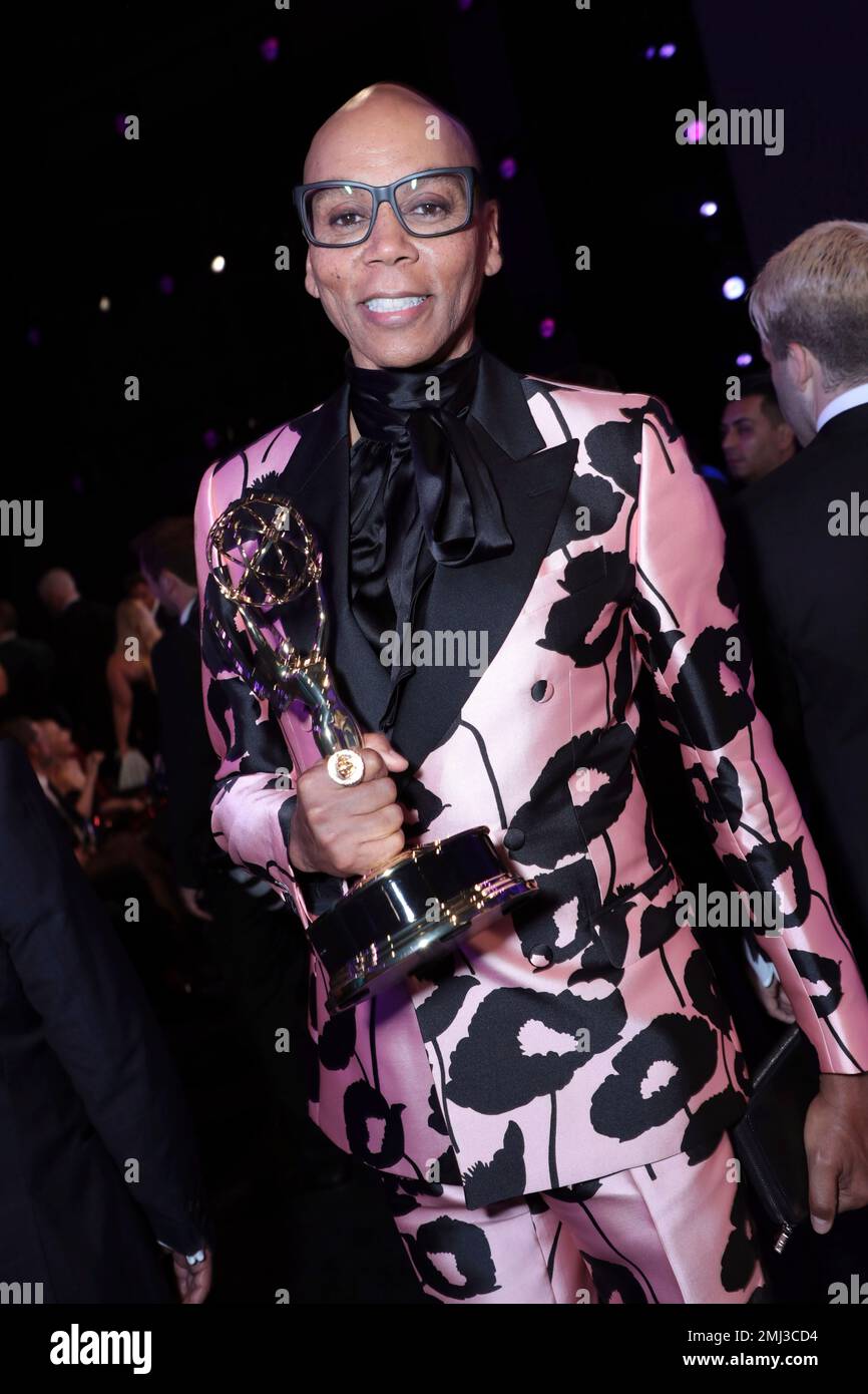EXCLUSIVE - RuPaul poses with the award for outstanding competition ...