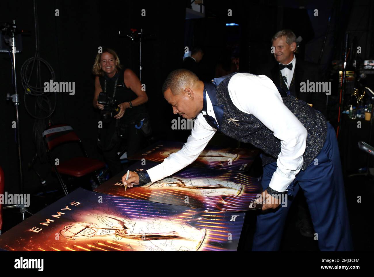 Terrence Howard signs posters backstage at the 71st Primetime Emmy ...
