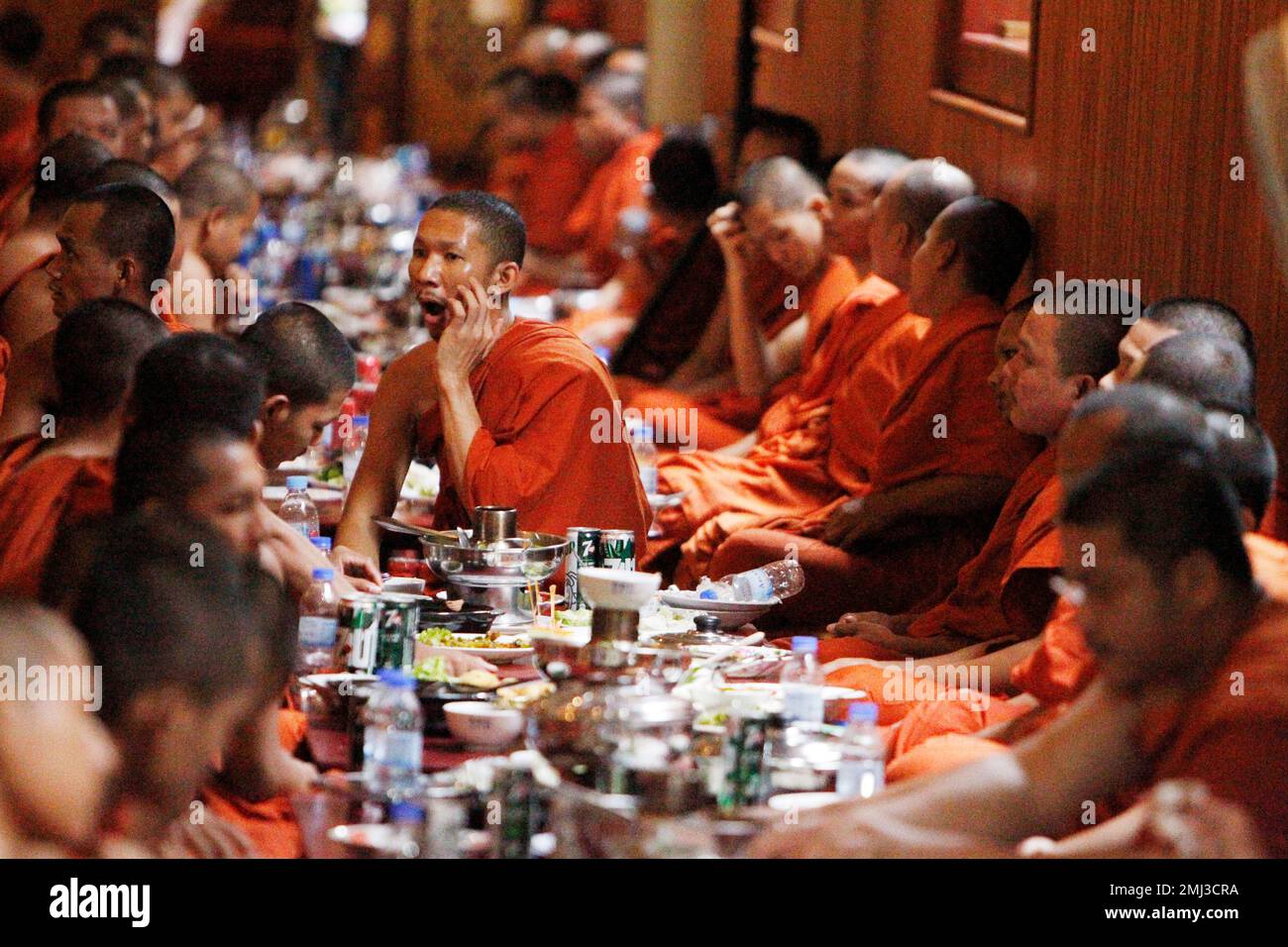Buddhist monks having lunch together during a celebrate Pchum Ben or ...
