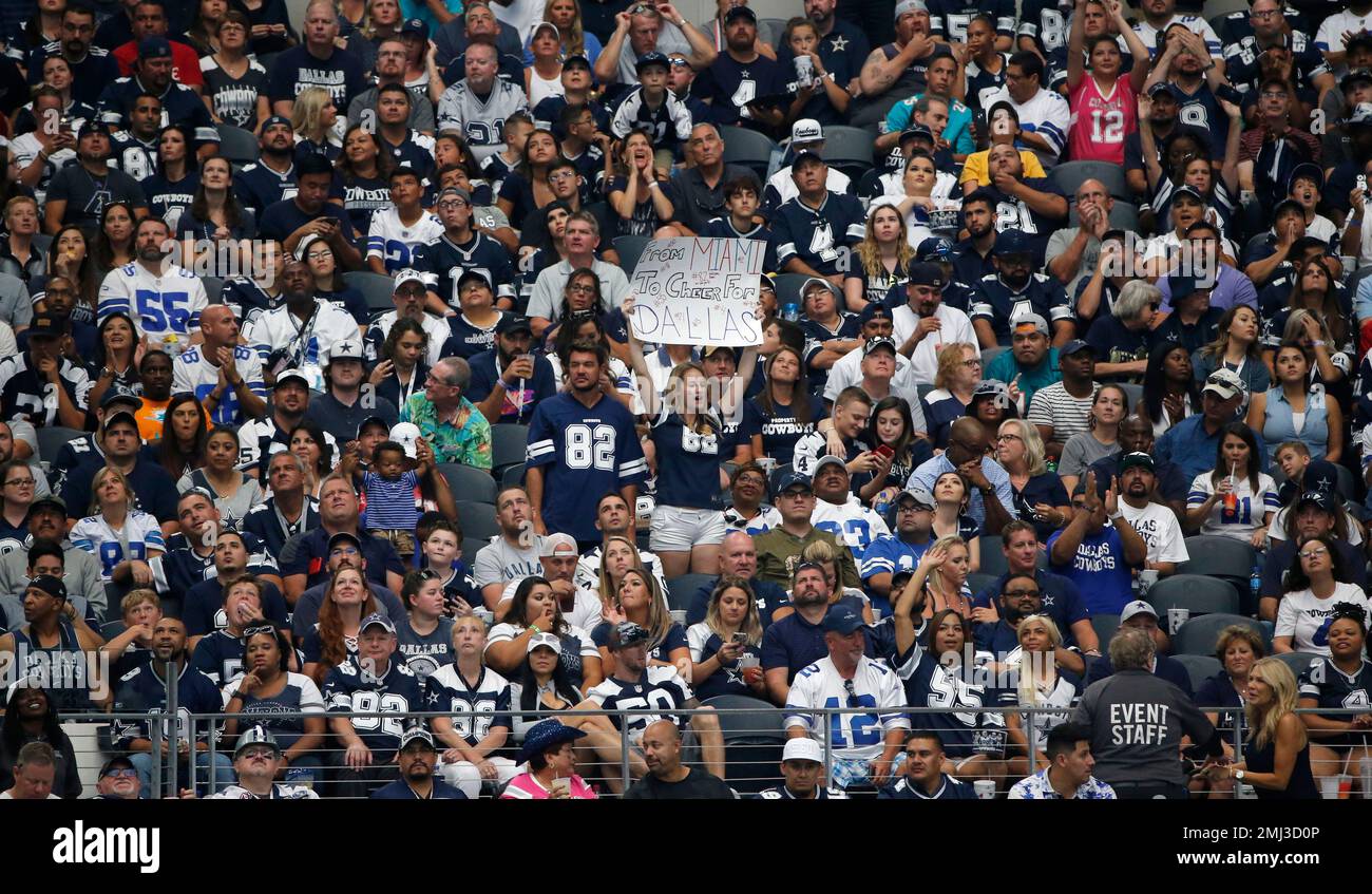 Dallas Cowboys fans watch as the Cowboys play the Miami Dolphins during ...