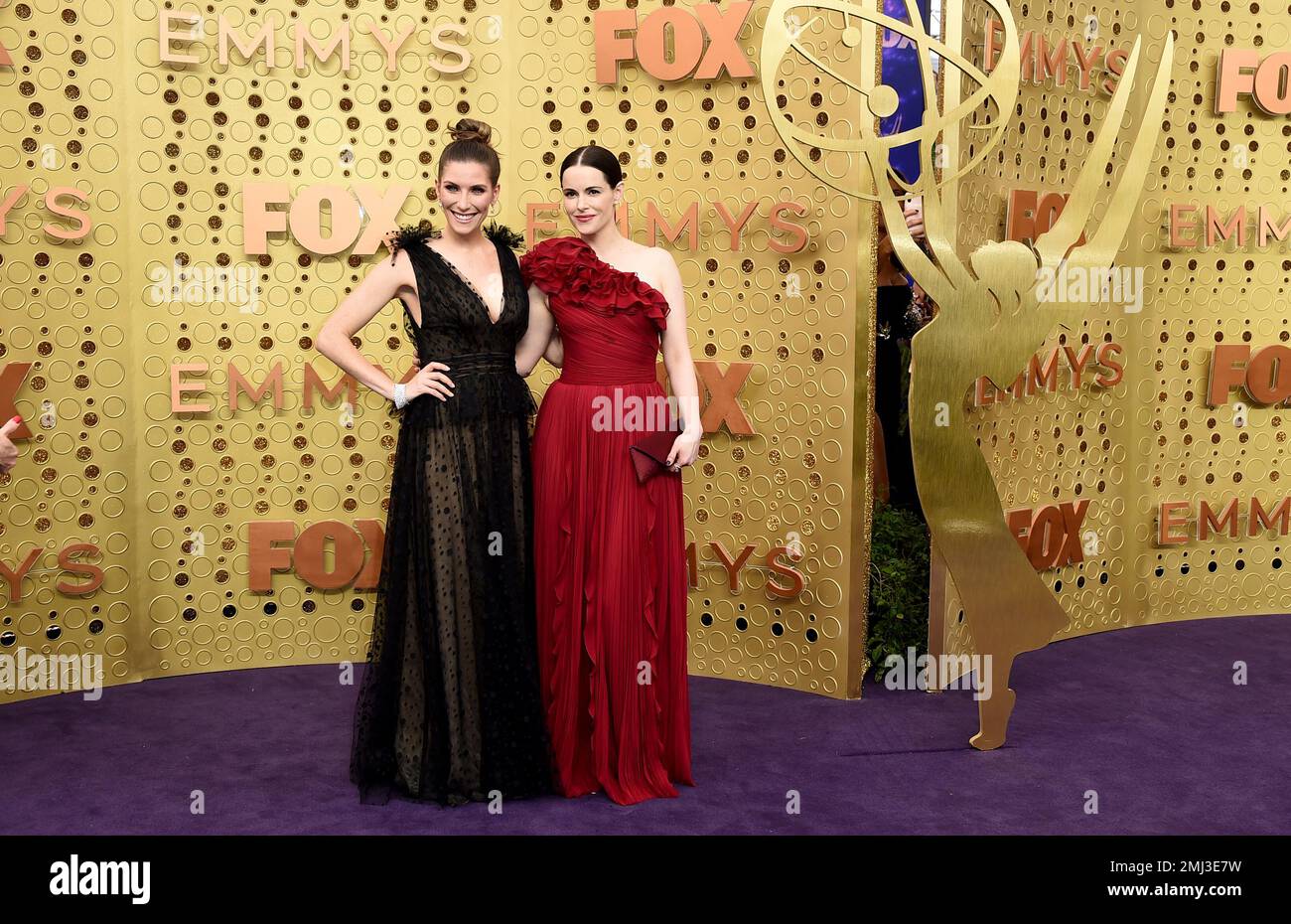 Sarah Levy, left, and Emily Hampshire arrive at the 71st Primetime Emmy ...