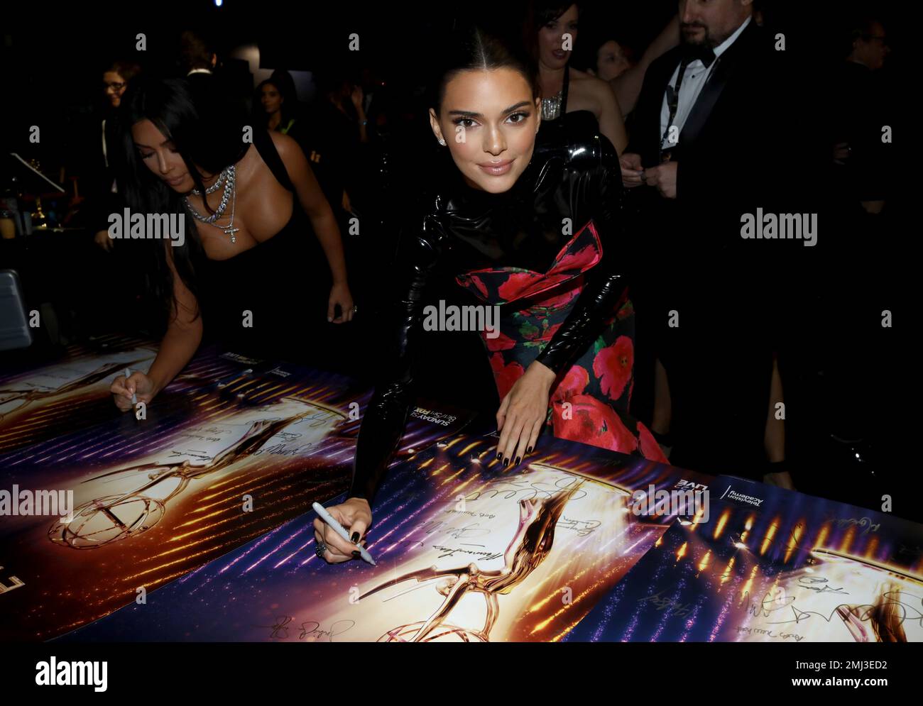 Kendall Jenner signs her autograph backstage at the 71st Primetime Emmy ...