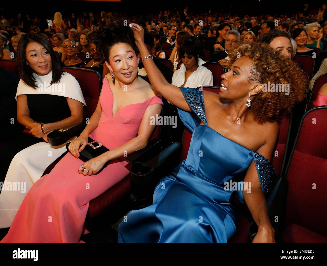 Grace Oh, from left, Sandra Oh and Ryan Michelle Bathe in the audience ...