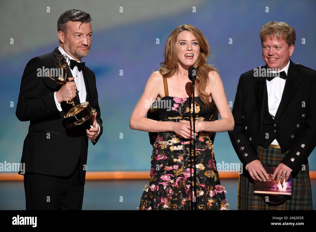 Charlie Brooker, from left, Annabel Jones, and Russell McLean accept ...