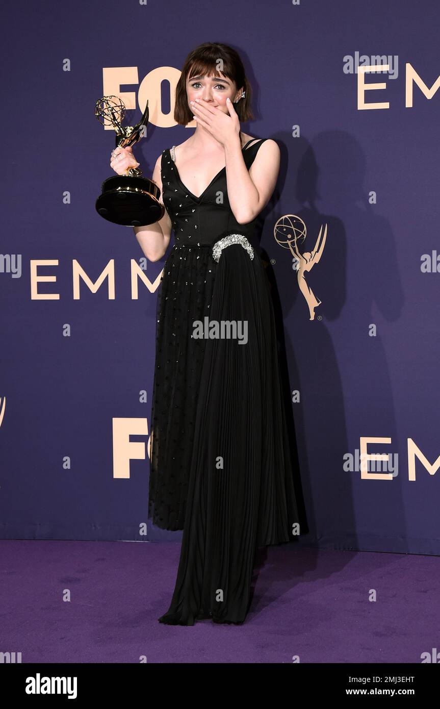 Maisie Williams poses in the press room with the award for outstanding ...