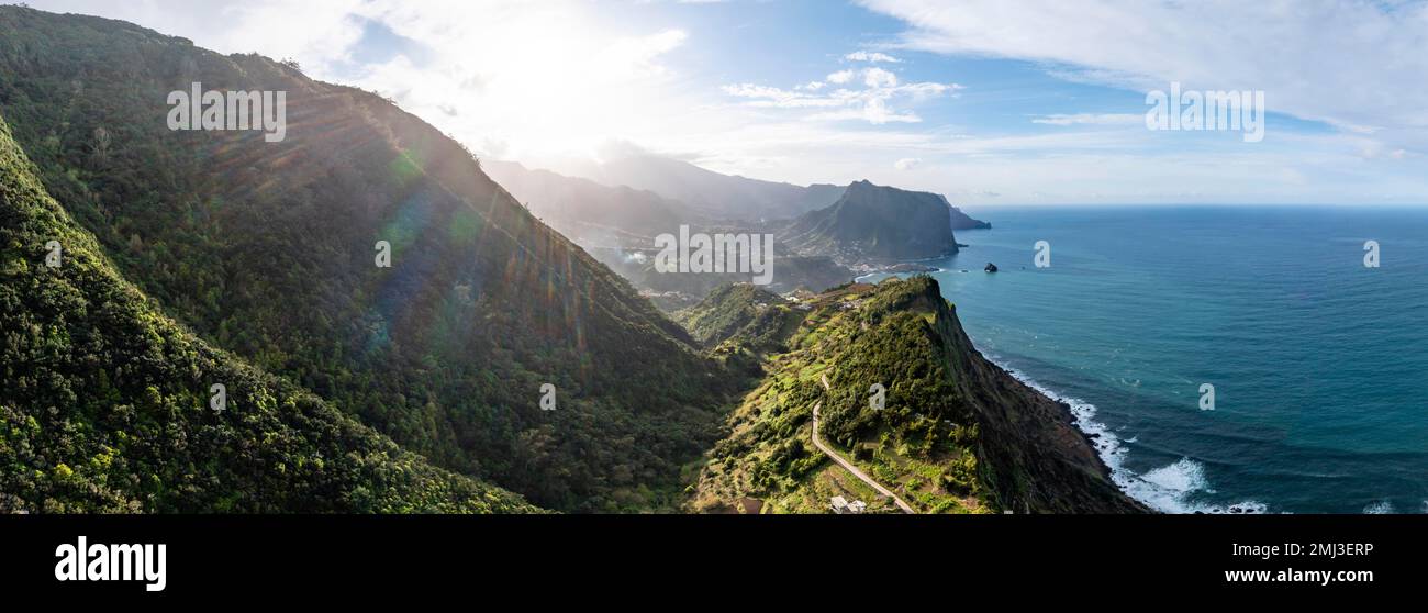 Aerial view, cliffs and mountains covered with forest, coast and sea ...